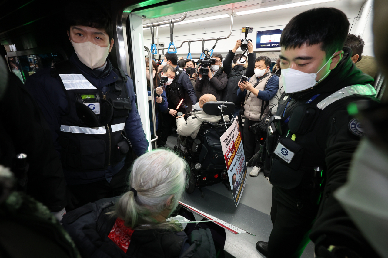 Subway train skips Samgakji Station due to protest by disability rights ...