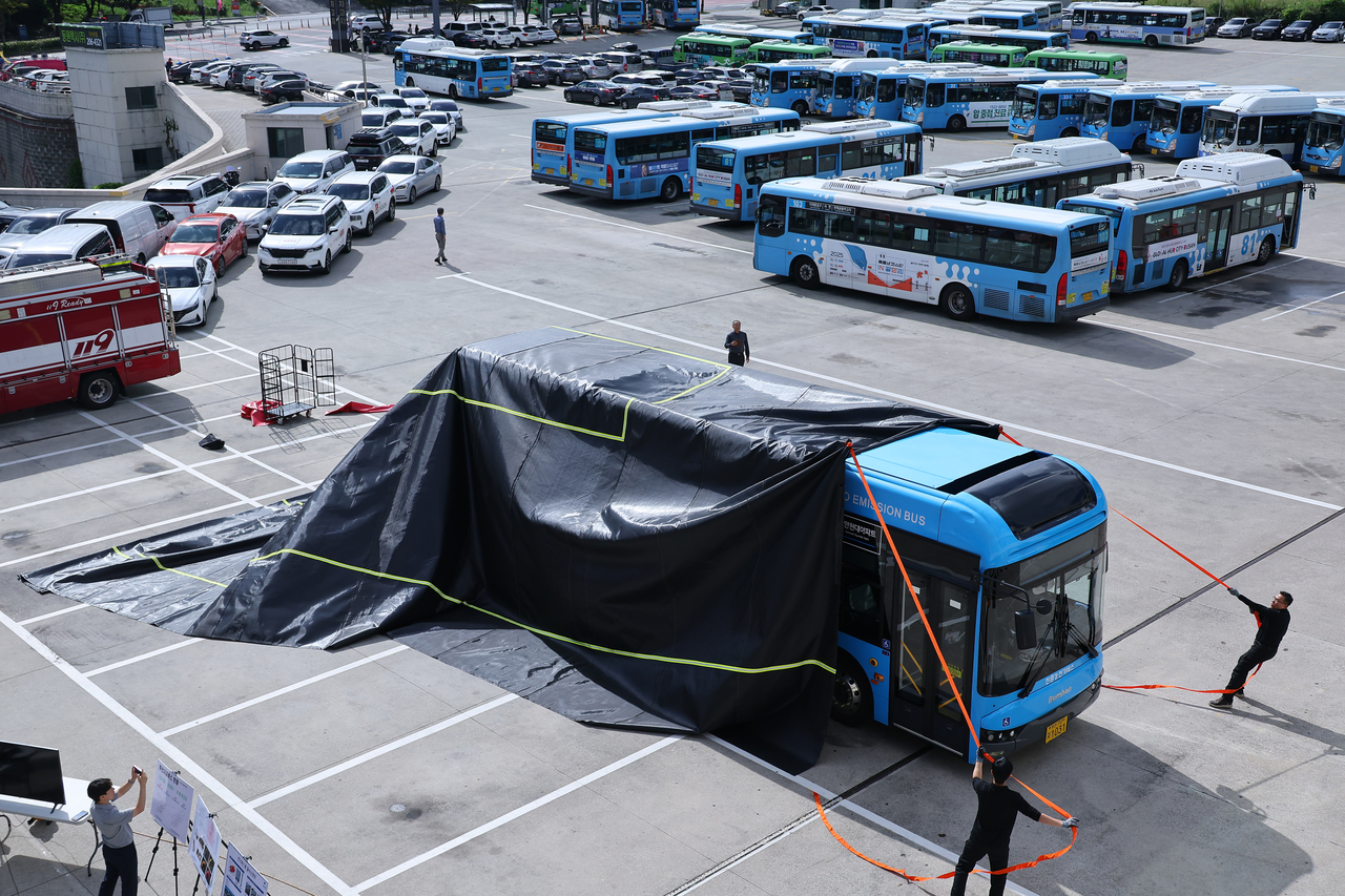 Fire blankets for electric buses - The Korea Herald